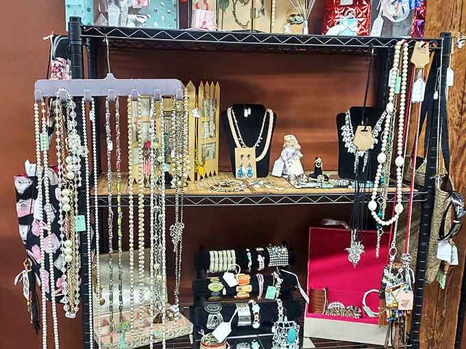 Jewelry displays showcase decades of adornment trends, from Victorian mourning brooches to colorful mid-century costume pieces.