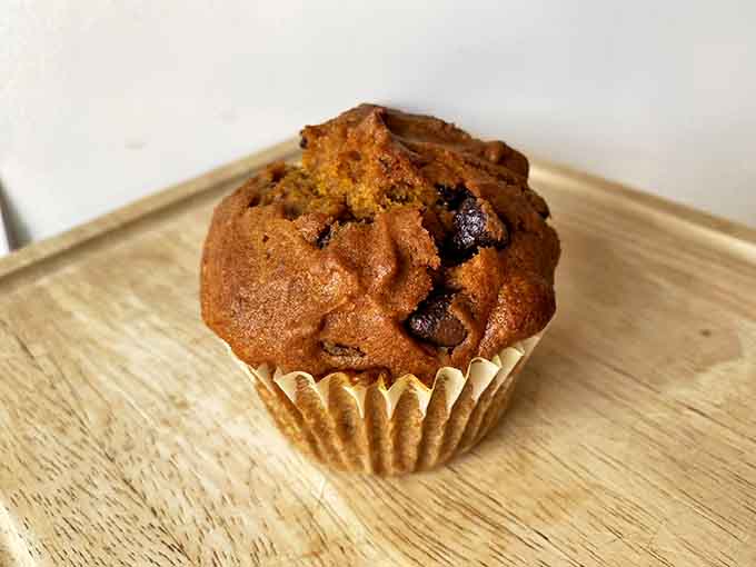 This pumpkin chocolate chip muffin isn't just breakfast &ndash; it's autumn's greatest hit in edible form, with melty chocolate pockets hiding like buried treasure.