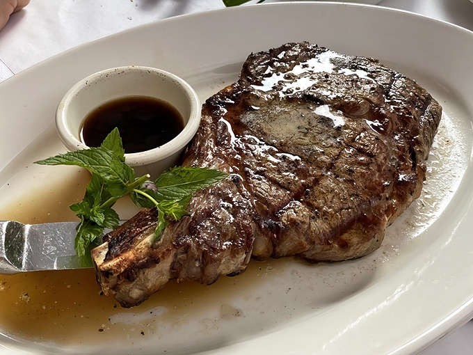 This isn't just a steak; it's a masterpiece of meat, seared to perfection and glistening with juices that would make vegetarians question their life choices.