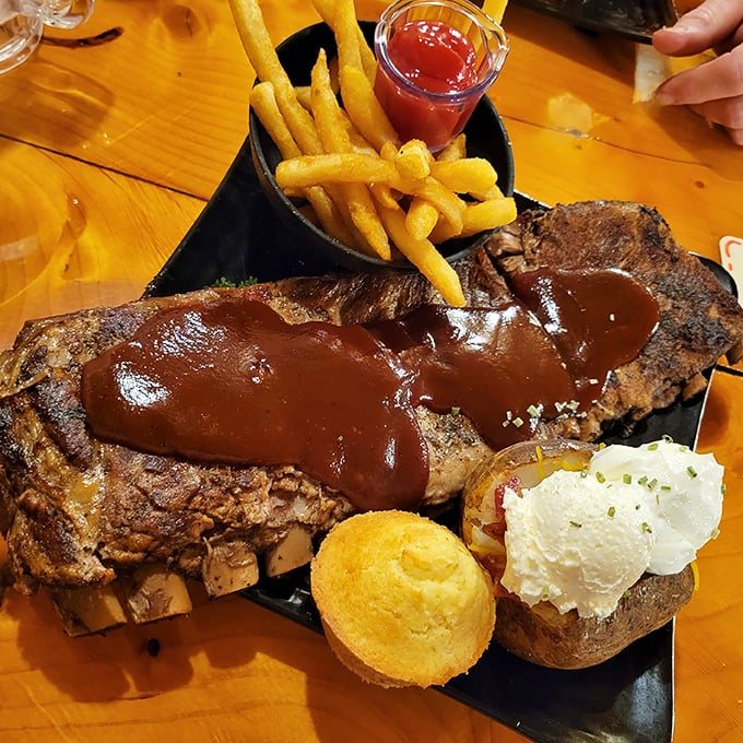 Behold the star attraction: fall-off-the-bone ribs lacquered with that perfect sauce, served with all the fixings a barbecue lover could desire.