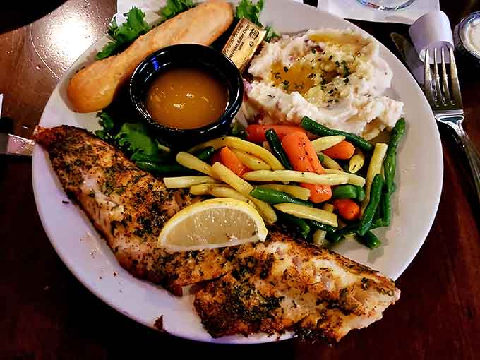 Blackened walleye arrives with colorful vegetables and garlic mashed potatoes, proving healthy eating doesn't mean sacrificing flavor or satisfaction.