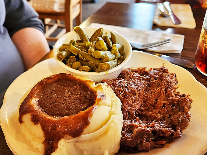 Roast Beef: Tender slices of perfectly seasoned beef alongside creamy mashed potatoes and green beans &ndash; a plate that whispers "welcome home."