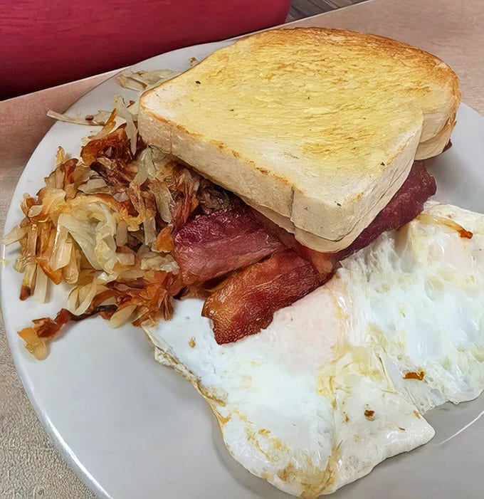 Breakfast perfection: crispy hash browns, eggs just right, bacon with that ideal crisp-to-chewy ratio, and toast for sopping up goodness.