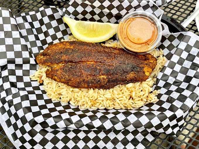 Blackened catfish with that perfect crust and vibrant purple slaw, proof that landlocked states can do seafood right when they try.