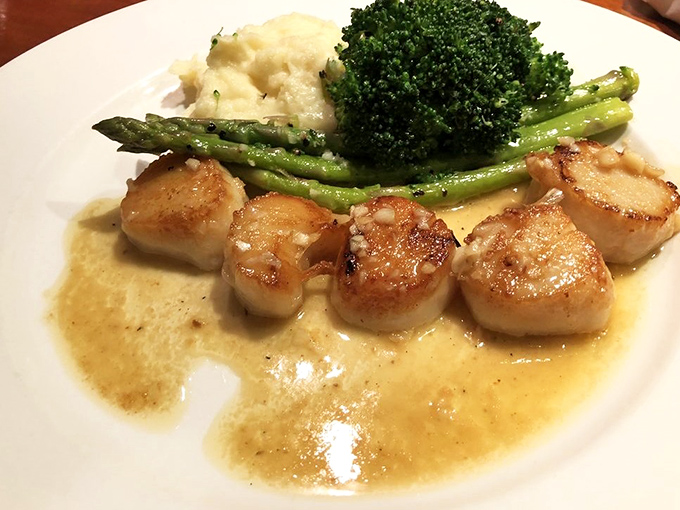 Golden-seared perfection meets buttery tenderness &ndash; these local sea scallops showcase why sometimes the simplest preparation yields the most profound flavors.