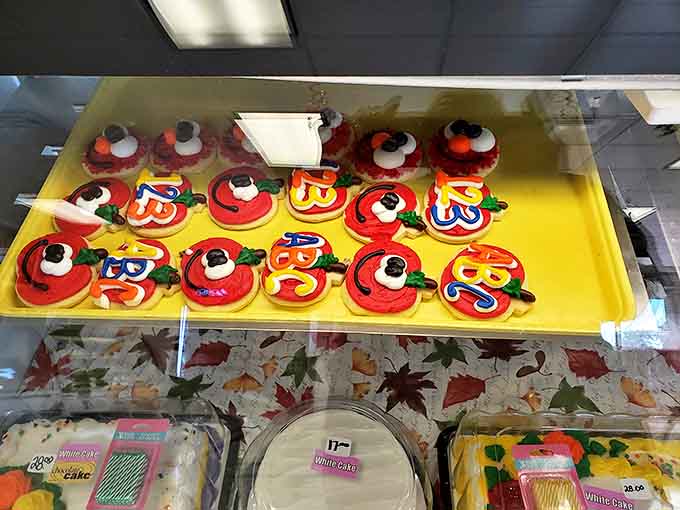 These vibrant apple-shaped cookies aren't just treats; they're edible autumn postcards, bringing harvest warmth to any celebration with their cheerful red glow.