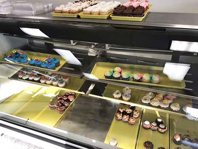 The cupcake display case at Schuler's looks like a pastry chef's fever dream, organized chaos in the most delicious way possible.