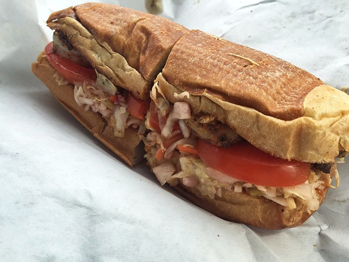 A masterpiece of textures &ndash; crispy golden shrimp nestled in French bread with fresh veggies creating the perfect handheld symphony.