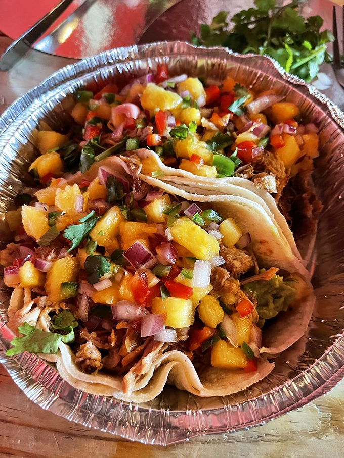 Tacos that tell a story &ndash; slow-smoked meat crowned with vibrant pineapple salsa creates a perfect harmony of flavors in every bite.