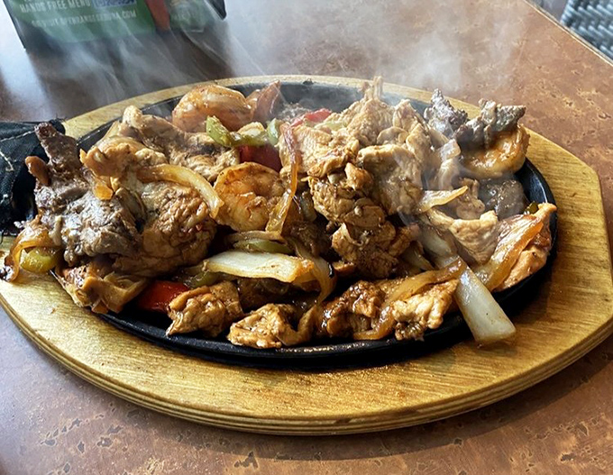Sizzling fajitas that announce their arrival before you even see them. The sound alone makes neighboring diners experience immediate food envy.
