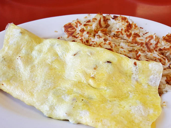 That golden omelet and perfectly crispy hash browns are the kind of breakfast that makes you want to high-five the chef.