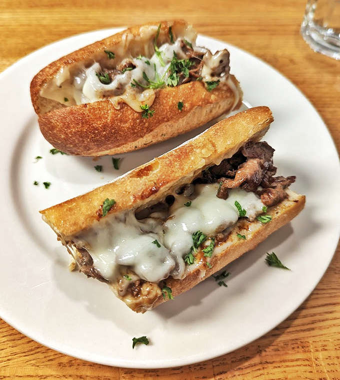 The legendary steak sandwich in all its glory &ndash; perfectly toasted bread cradling tender, flavorful meat and melted cheese that would make a steakhouse jealous.