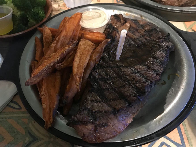 This isn't just any steak &ndash; it's a masterclass in simplicity, perfectly seasoned and grilled, paired with sweet potato fries that could convert any skeptic.