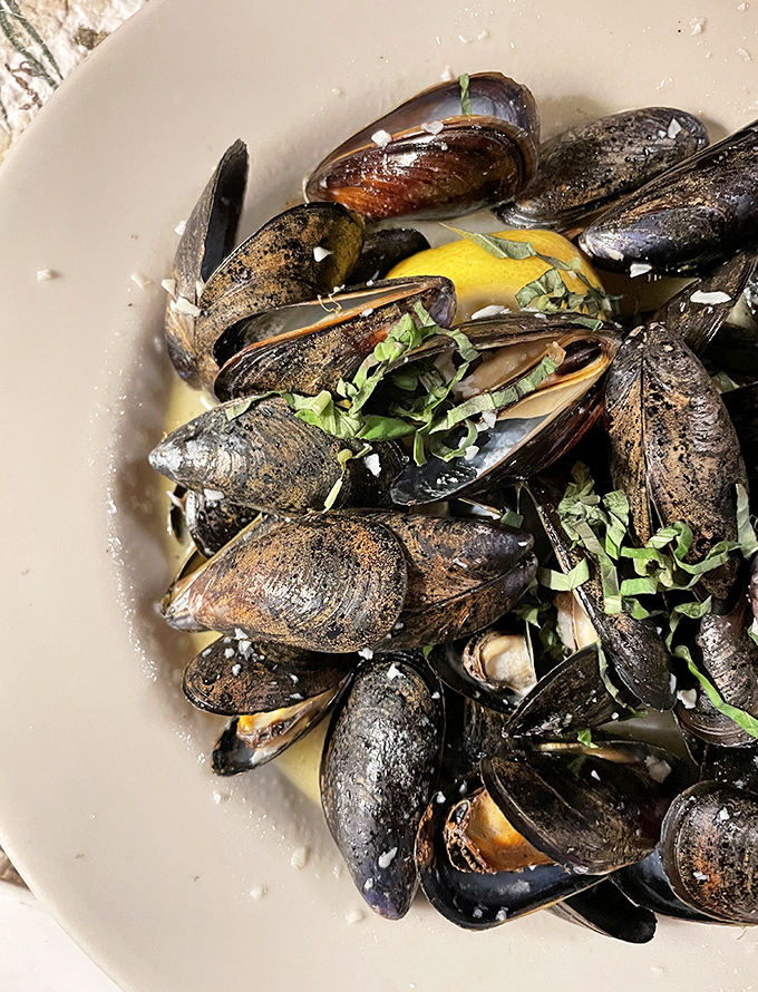 Those legendary P.E.I. mussels &ndash; plump, tender, and swimming in a white wine broth that you'll want to bathe in.