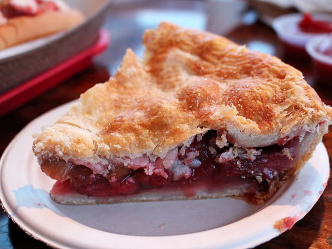 A slice of heaven on earth – the strawberry rhubarb pie that makes grown adults consider ordering dessert first, just in case.