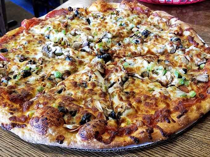 Loaded with mushrooms, olives, peppers, and onions, this supreme-style beauty shows why people drive hours for Sven & Ole's pizza.