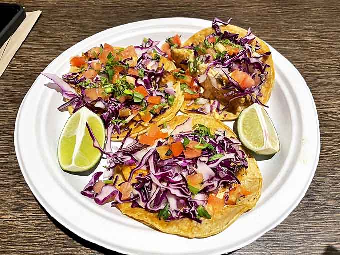 These aren't just tacos &ndash; they're edible joy wrapped in tortillas, where vibrant purple cabbage and fresh cilantro dance atop perfectly smoked meat.