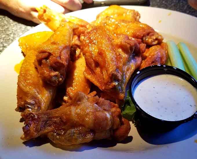 Golden, glistening, and gloriously sauced, these Buffalo wings have inspired road trips and passionate devotion across Minnesota.