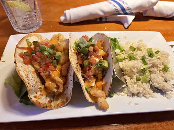 Those shrimp tacos arrive looking like they took a wrong turn from a coastal seafood shack and ended up in Minnesota.