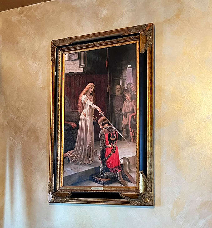 The Accolade painting adds romantic medieval flair, depicting a queen knighting her champion in this gilded reproduction.