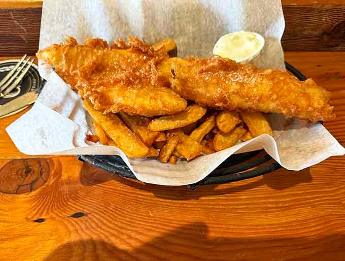 Golden batter shattering at first bite, revealing tender fish that makes you forget every disappointing version you've ever had.