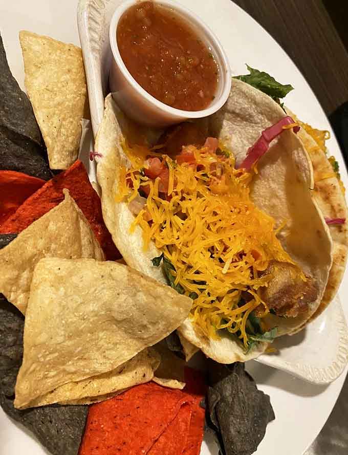 Behold the star of the show: walleye tacos that showcase Minnesota's favorite fish in all its flaky, flavorful glory, served with colorful tortilla chips.