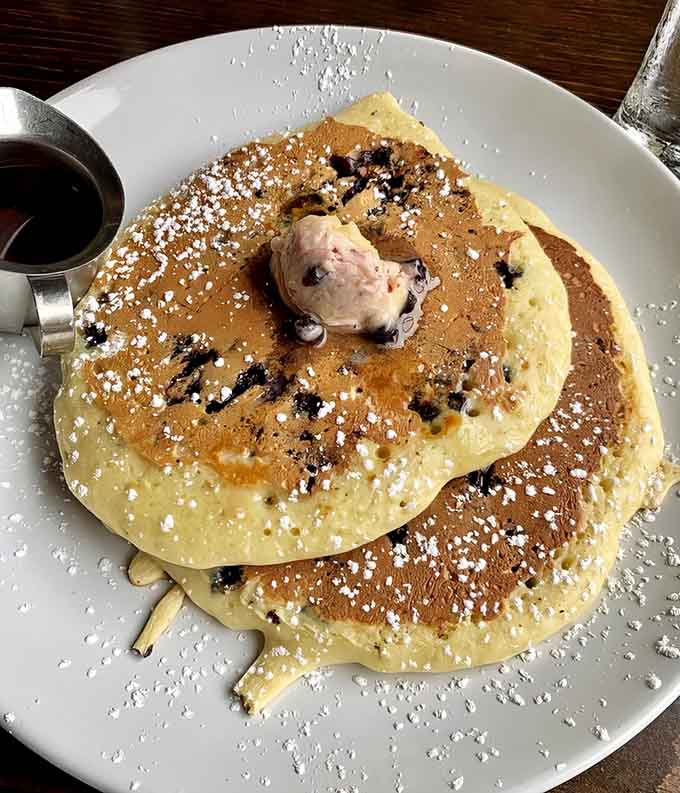 Golden perfection studded with plump blueberries and dusted with powdered sugar, these pancakes are what breakfast dreams are made of, folks.