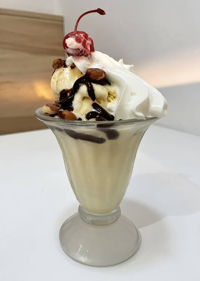 The Tin Roof Sundae &ndash; where vanilla ice cream meets hot fudge and Spanish peanuts in a textural symphony that makes taste buds stand and applaud.