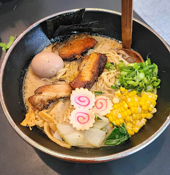 This Tonkotsu Ramen isn't just soup; it's a transformative experience featuring a milky, rich broth that's been simmered to perfection.
