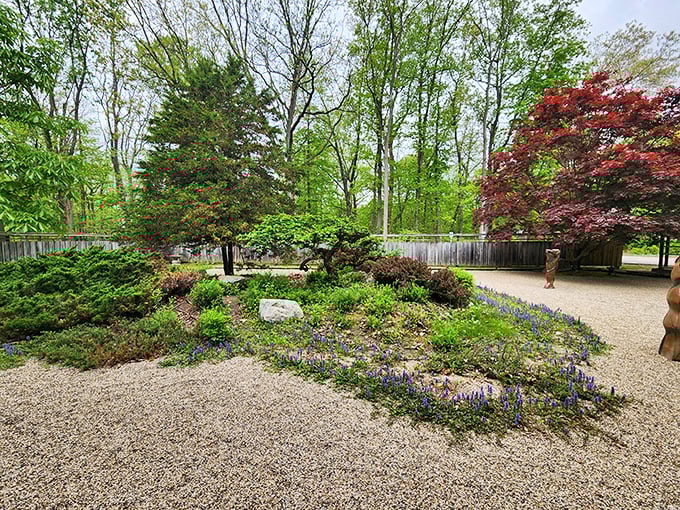 A perfectly manicured Japanese-inspired garden section creates a zen moment amid Michigan's natural landscape.