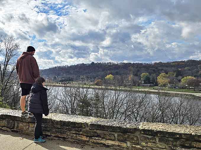 Visitors pause at the stone overlook, drinking in sweeping views that make everyday worries seem as distant as the horizon.