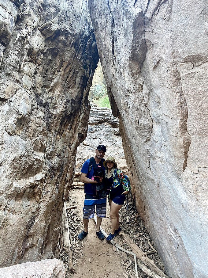 Adventure buddies navigating the narrow passage, where canyon walls squeeze together like nature's version of a friendly hug.