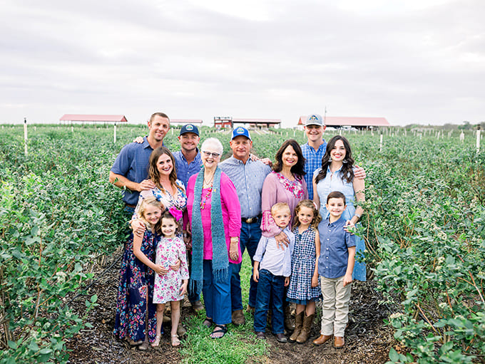 A family gathering among the crops represents generations of farming tradition and the community spirit that makes Southern Hill Farms special.