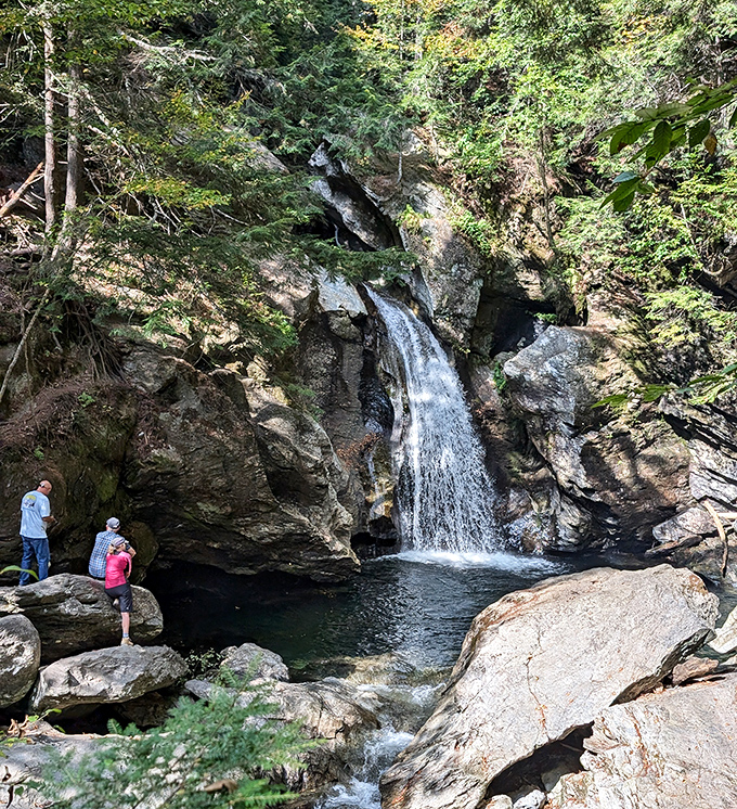 The reward for curious explorers: Bingham Falls' powerful cascade creates a natural swimming hole worth every step of the journey.
