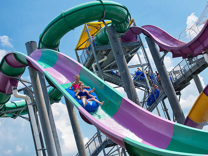 Colorful water slides twist and turn against the blue sky, promising the perfect combination of terror and delight.