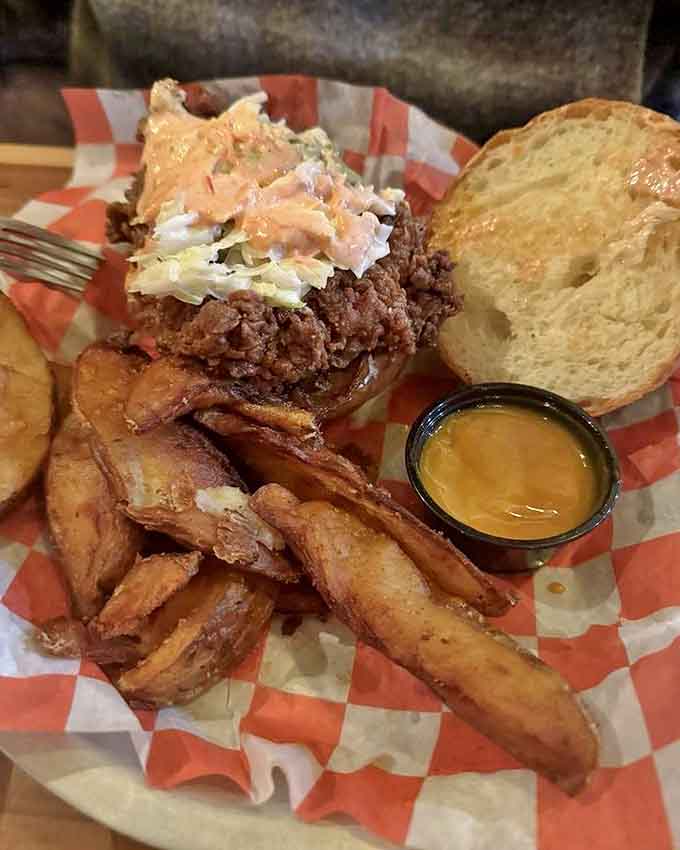 This hot chicken sandwich isn't just food&mdash;it's an experience, with crispy fried chicken nestled on a soft bun alongside golden hand-cut fries.