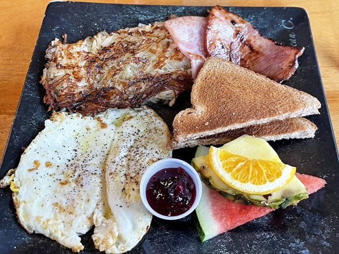 This hearty breakfast plate features perfectly crisped hash browns, eggs with just-right yolks, and toast that's actually worth eating.