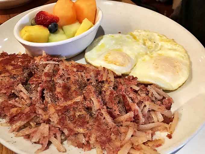 This isn't just corned beef hash; it's a masterclass in breakfast perfection. Crispy potatoes, tender beef, and those eggs? Breakfast nirvana achieved!