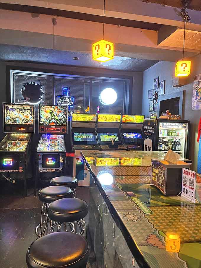 Mario-themed bar counters and chrome stools create the perfect perch for sampling craft brews between gaming sessions.