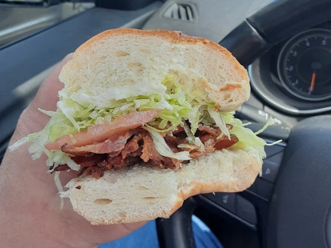 Not your average BLT! Thick-cut bacon meets garden-fresh lettuce and tomato on pillowy bread, proof that classics can still surprise.