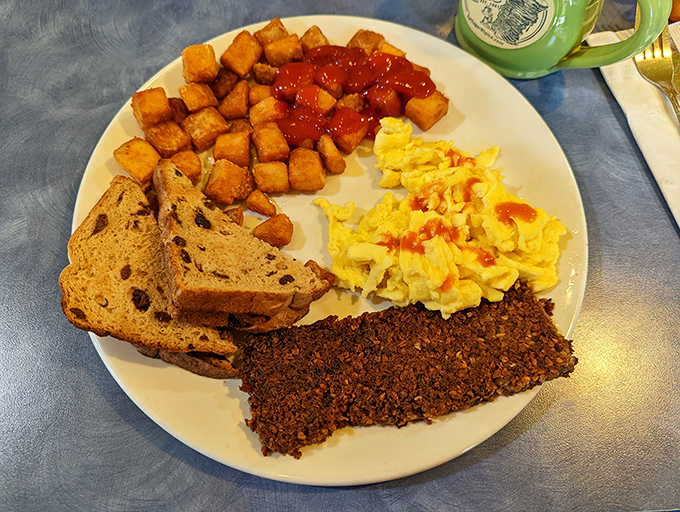 A breakfast symphony of eggs, home fries, toast, and Cincinnati's beloved goetta &ndash; a morning masterpiece on a plate.