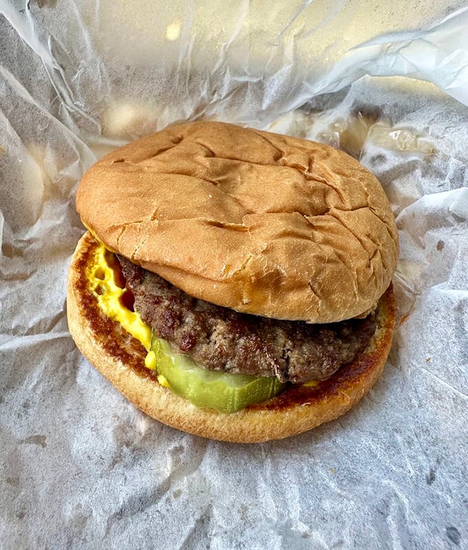 This isn't just any burger &ndash; it's an old-school masterpiece with a hand-formed patty, melty cheese, and pickle slices that bring the perfect tangy crunch.