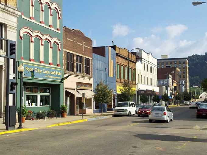 Colorful historic buildings line downtown streets, creating the kind of Main Street that chain stores tried to replicate but never quite captured the soul of.