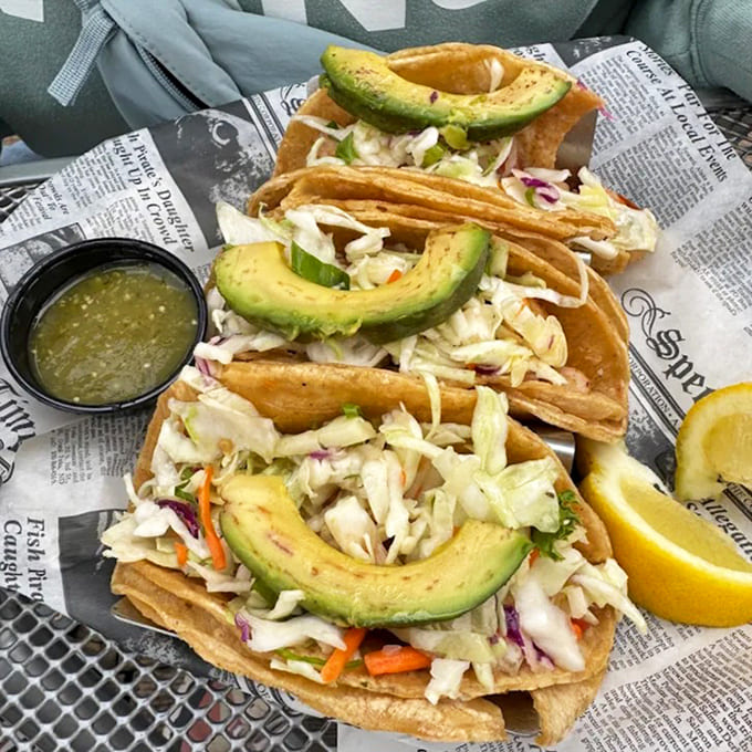 These aren't just fish tacos&mdash;they're edible postcards from paradise. Crispy tilapia, fresh slaw, and creamy avocado create bite-sized vacation moments.