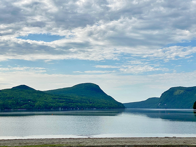 The distinctive profile of Mount Pisgah creates that fjord-like appearance that makes first-time visitors question their GPS location.