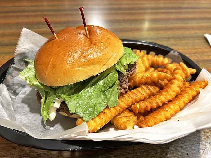 The legendary olive burger in all its glory &ndash; a perfectly seasoned patty topped with that famous olive spread, creating a flavor combination that's worth crossing state lines for.