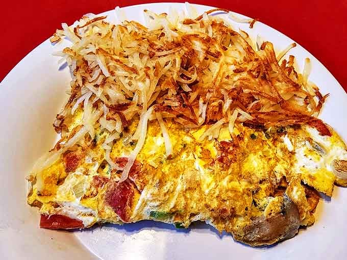 This isn't just any omelet &ndash; it's a fluffy masterpiece crowned with perfectly crispy hash browns that put your homemade attempts to shame.