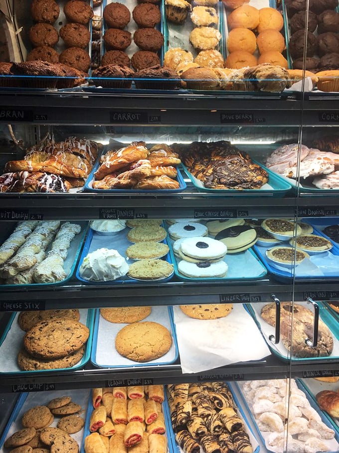 The display case at Lester's is like a museum of carbohydrate artistry, where muffins, cookies, and pastries compete for your affection.