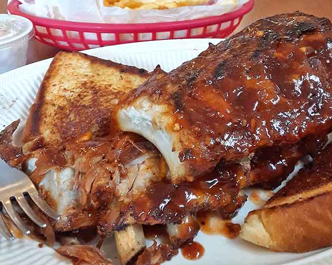 These ribs have earned their reputation one rack at a time, with meat so tender it practically waves goodbye to the bone.