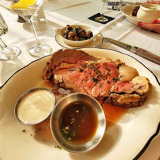 Behold the star attraction: prime rib cooked to pink perfection, accompanied by savory au jus and horseradish that means business.